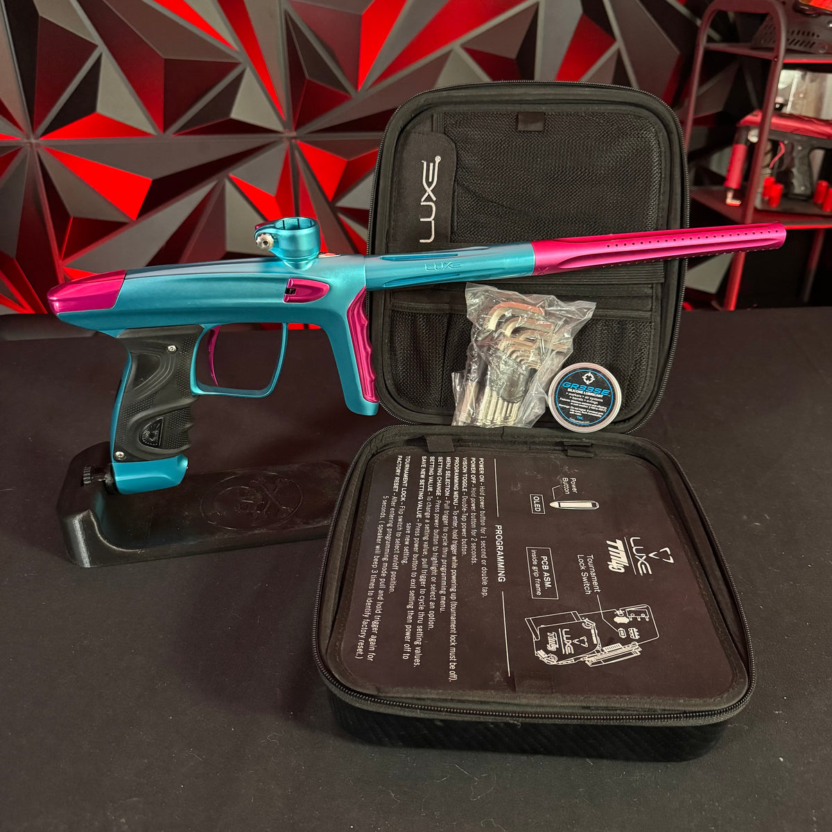Used DLX Luxe TM40 Paintball Gun - Dust Blue / Polished Pink