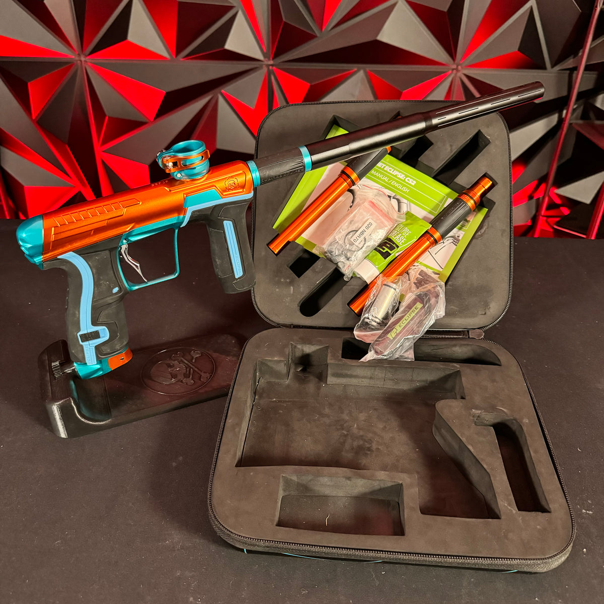 Used Infamous/Planet Eclipse CS2 Paintball Gun - Orange/Teal w/ 3 FL B