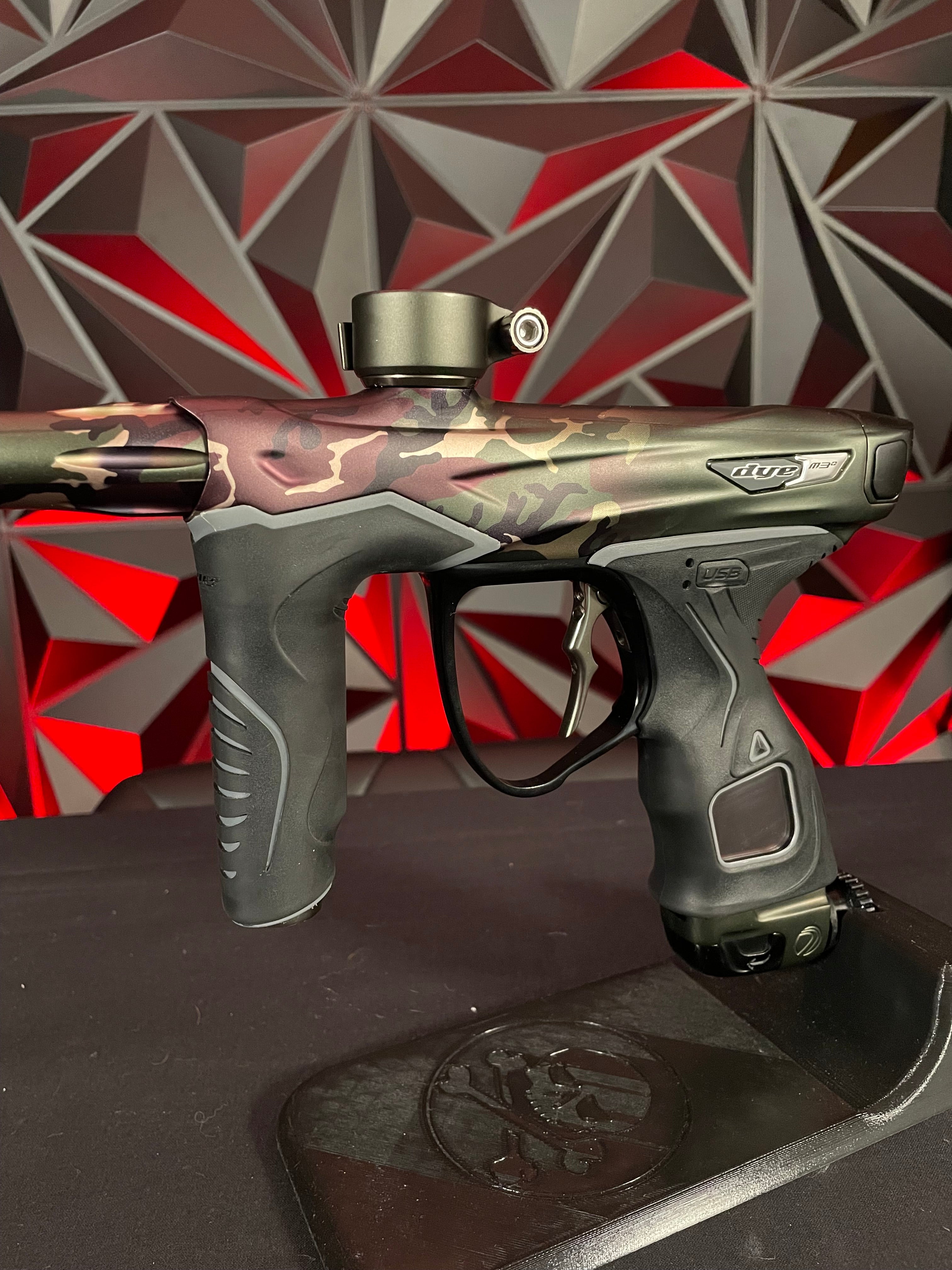 Used Dye M3+ Paintball Gun - PGA Woodland Camo w/MOSAir Charging Pad