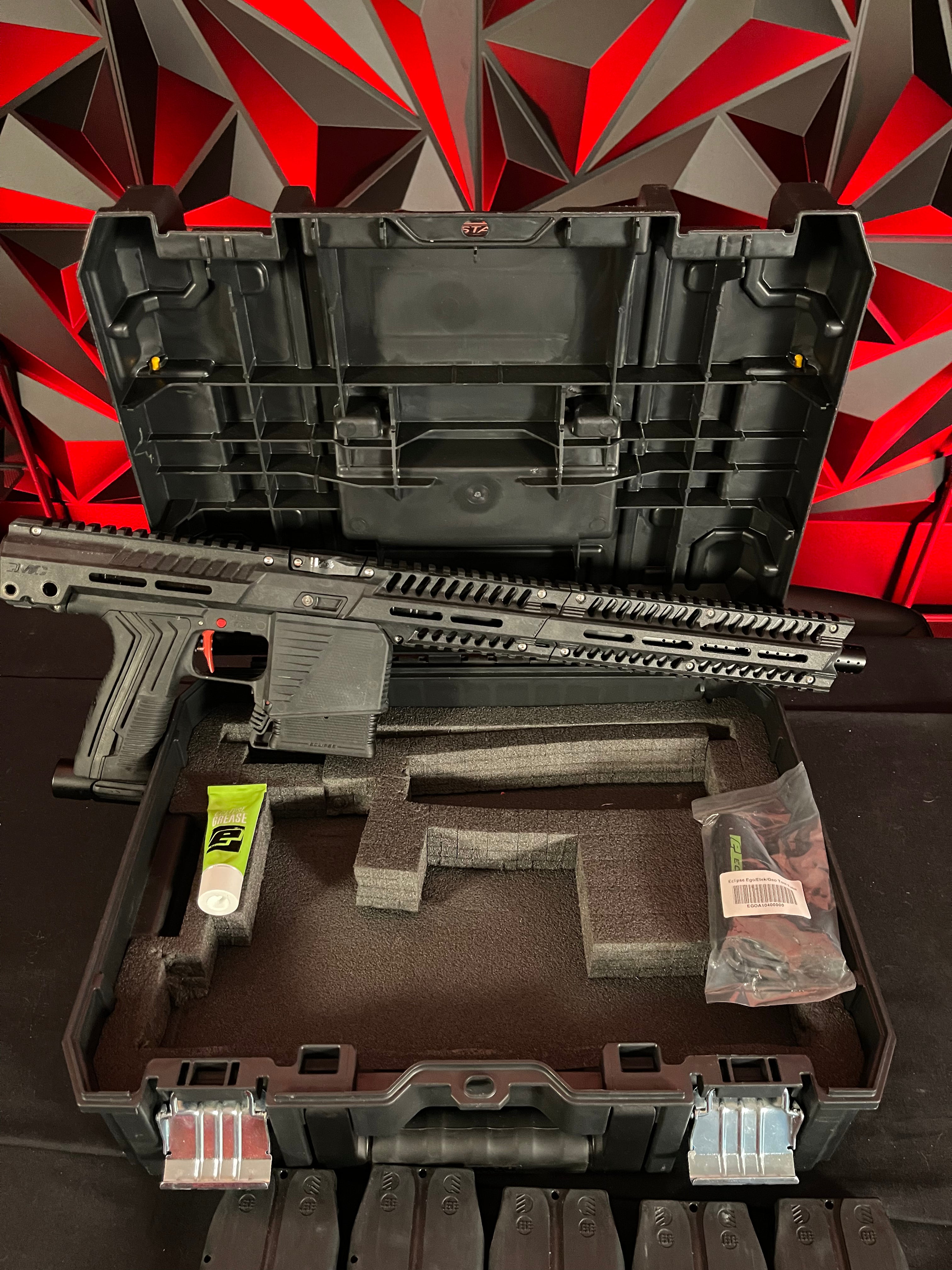 Used Planet Eclipse EMF100 Paintball Gun - Black w/ Red Trigger & 5 CF