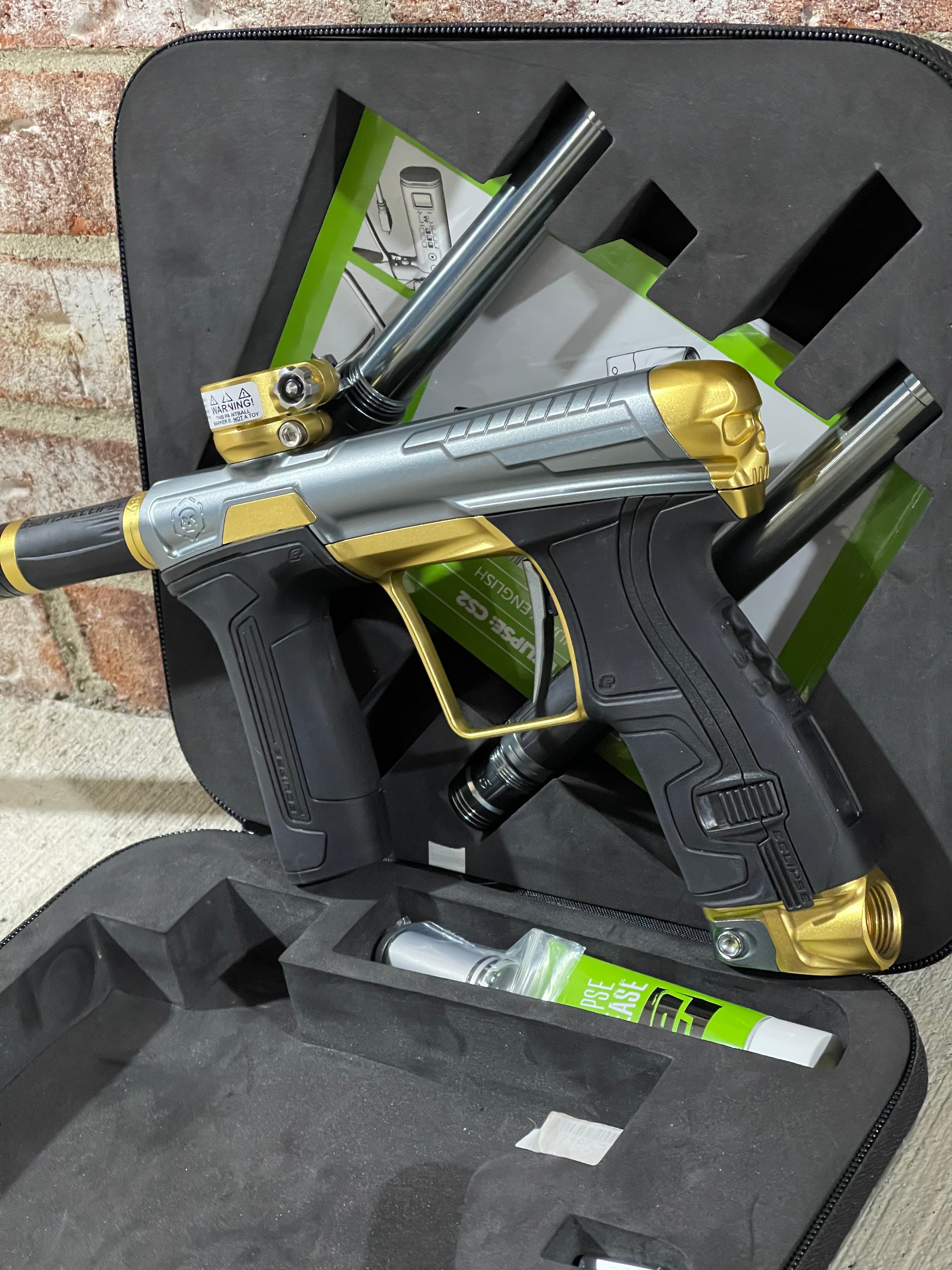 Used Infamous / Planet Eclipse CS2 Paintball Gun - Grey / Gold w/ 3 FL